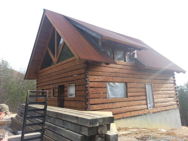 Full Log King Truss Tie Beam notch at full log walls?
